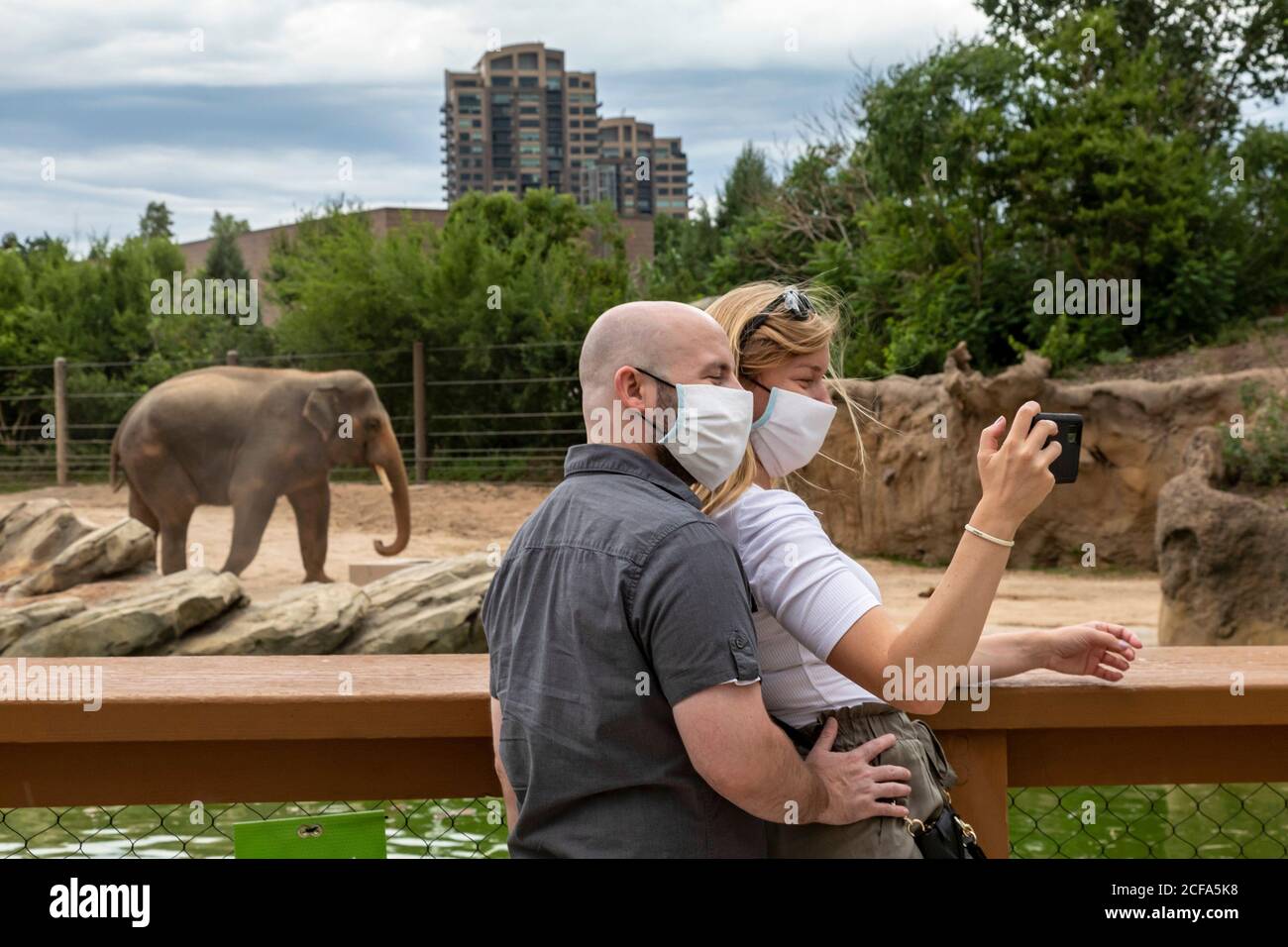 Denver, Colorado - Wearing face masks, visitors to the Denver Zoo pose ...