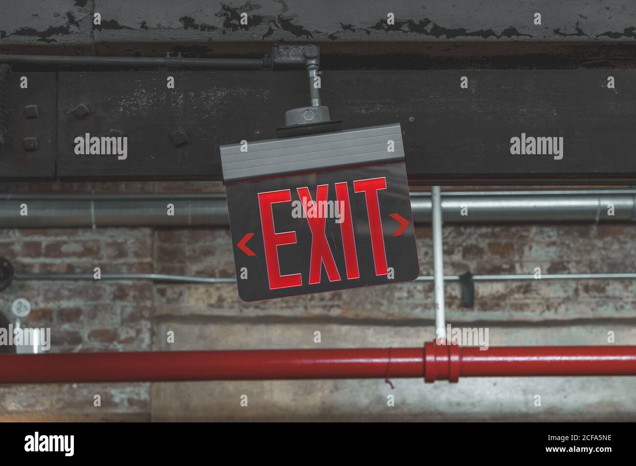 Exit sign showing directions with arrows in New York Stock Photo - Alamy