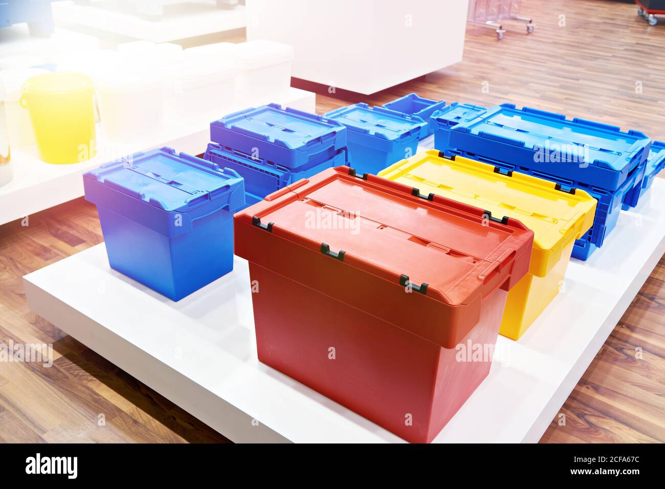 Color plastic tools boxes in hardware store Stock Photo - Alamy