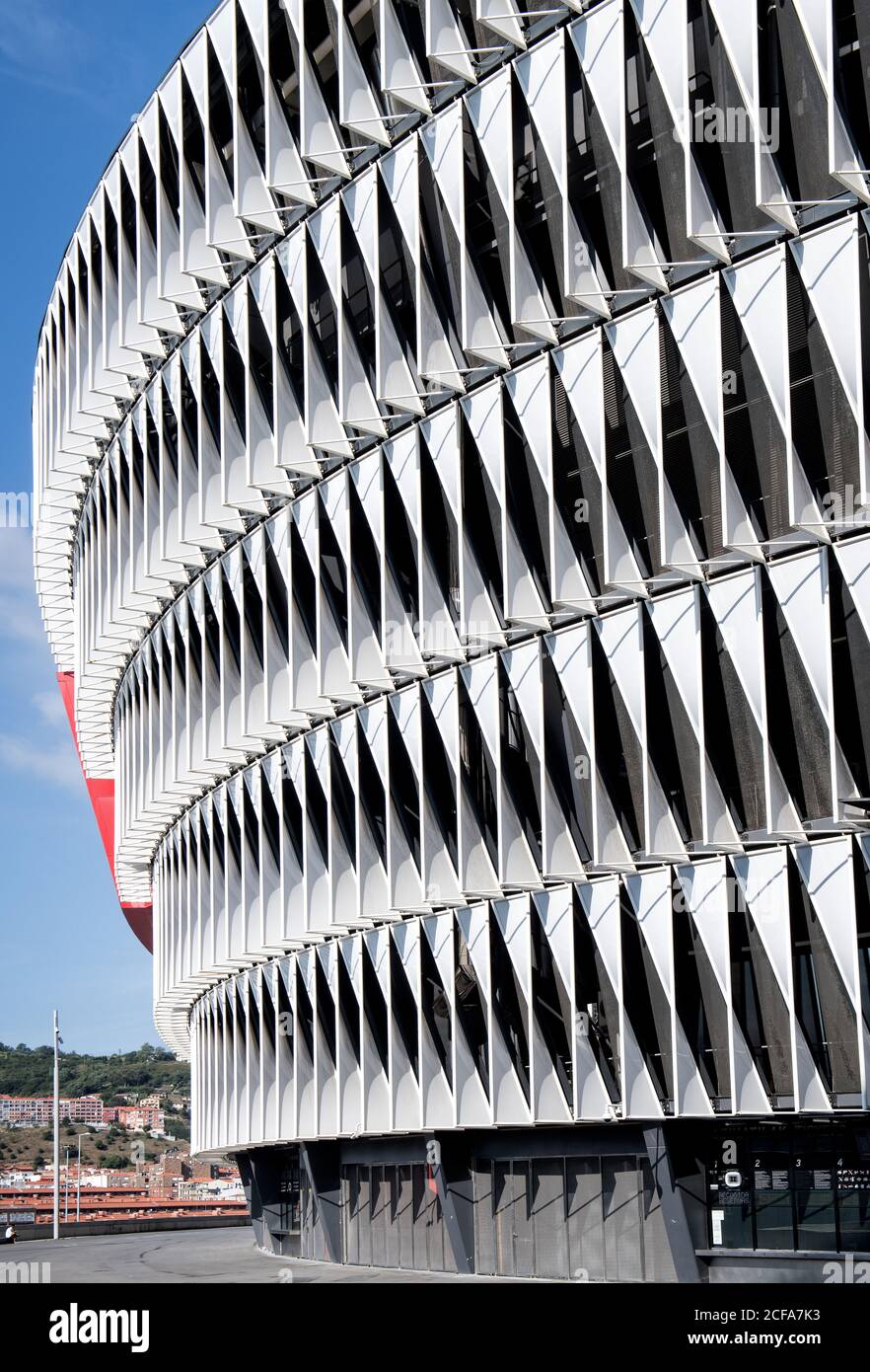Round building with massive facades with large gray panels in downtown ...