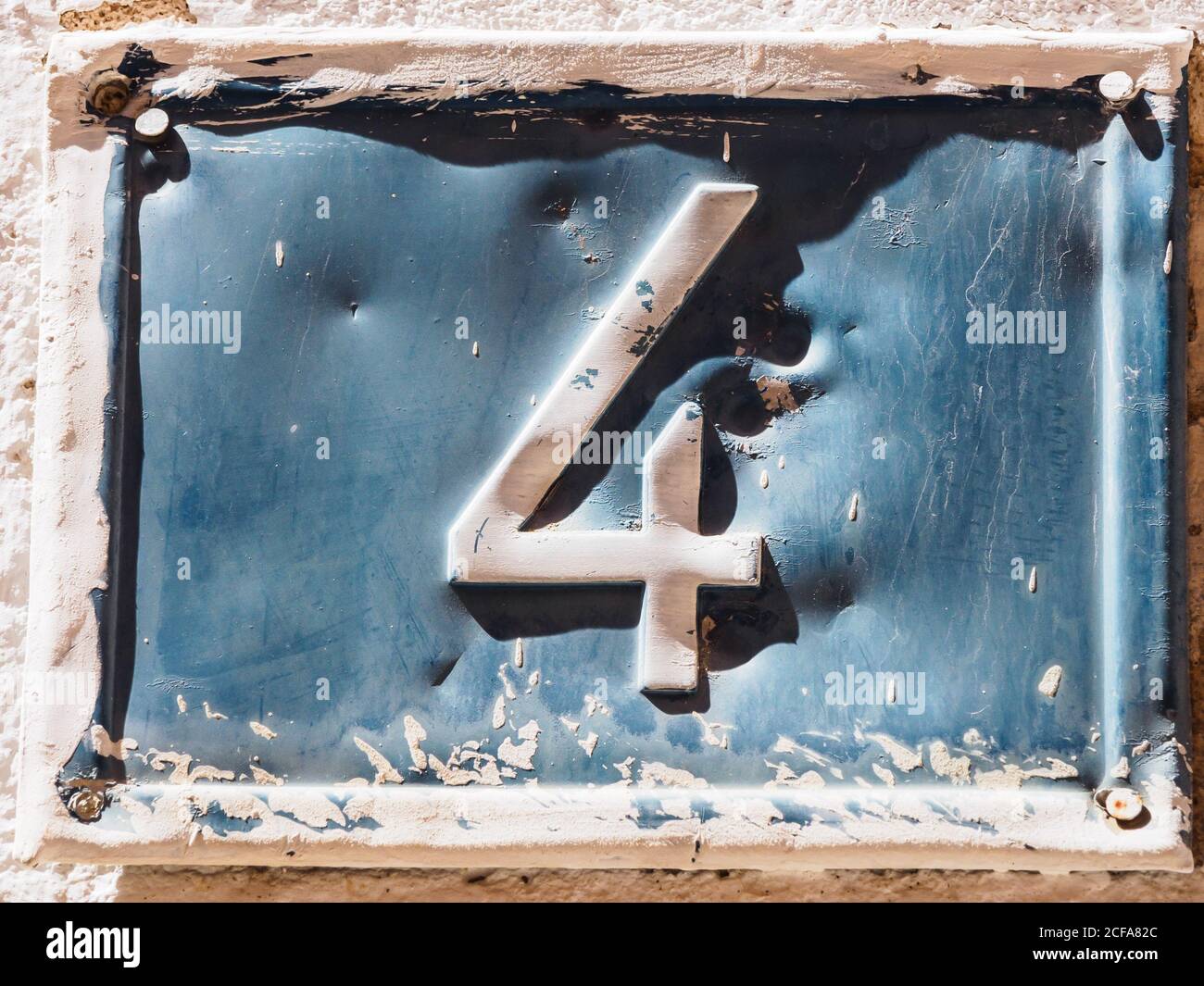 Closeup shot of the number 4 on a house sign Stock Photo - Alamy