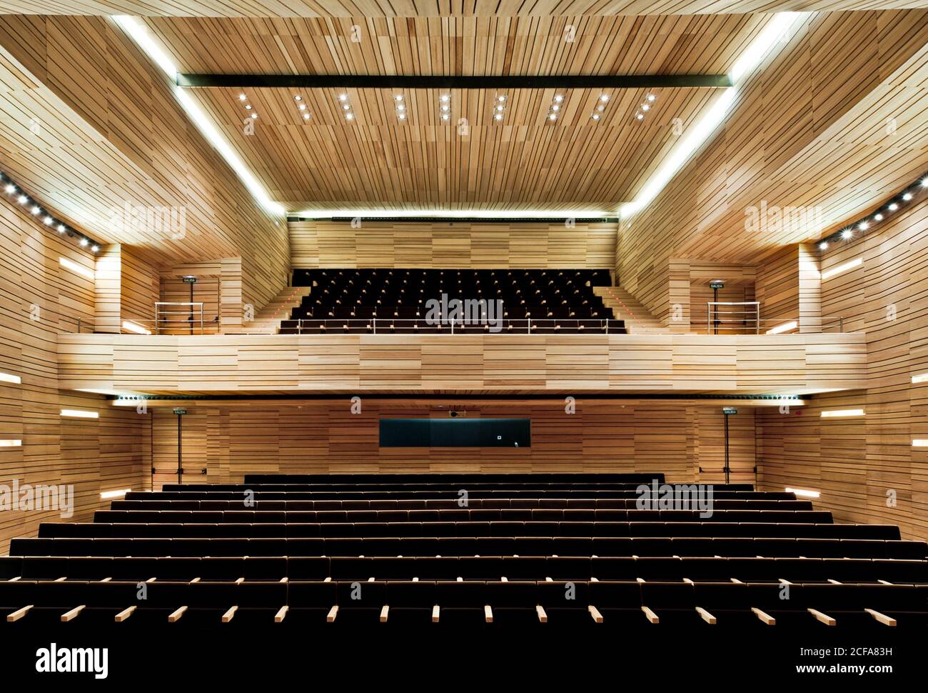 Spacious stylish auditorium with bright illumination and empty ...