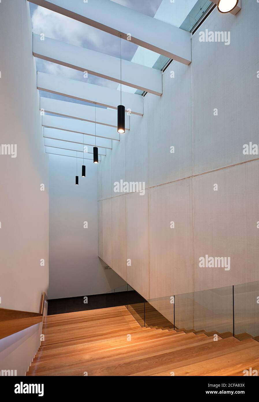 Modern facility with metal staircase and modern glass high ceiling ...