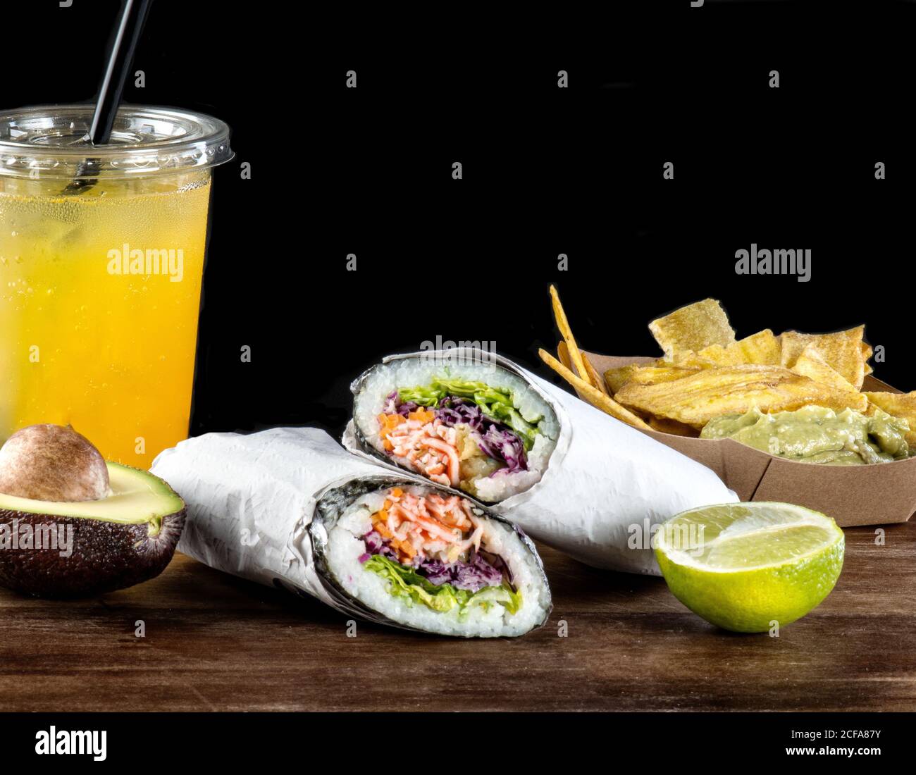 Set of typical Mexican snacks including fried plantains with guacamole ...