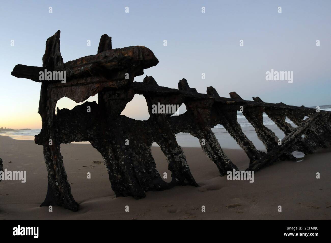 Decaying, rusty ship wrecked hull of a part buried on a Australian ...