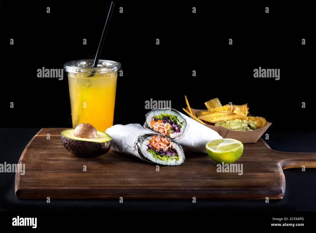 Set of typical Mexican snacks including fried plantains with guacamole ...