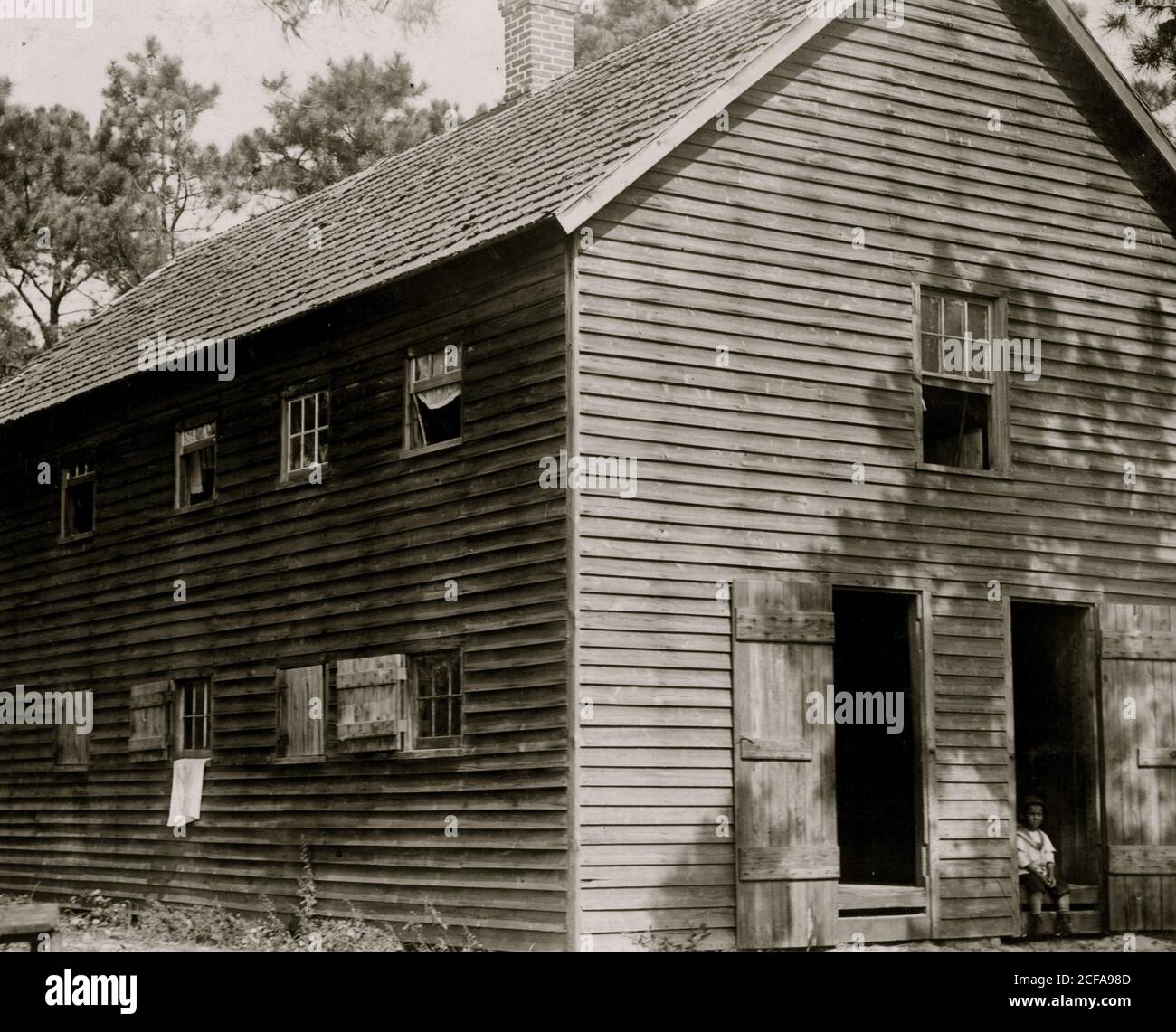 Exterior of one of the shacks containing 24 rooms Stock Photo - Alamy