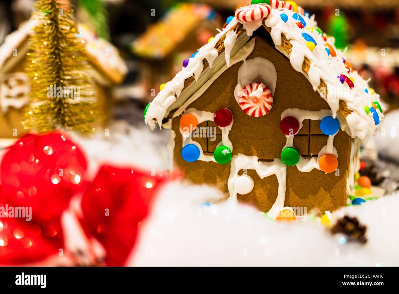 Colorful gingerbread house isolated on blurred background with ...