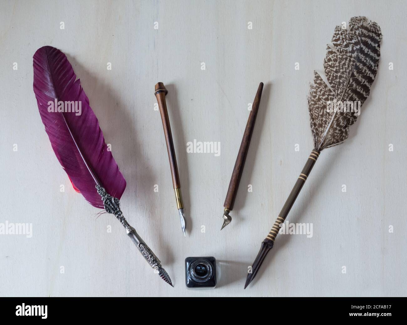 Closeup shot of silver fountain pens and ink on the desk Stock Photo ...