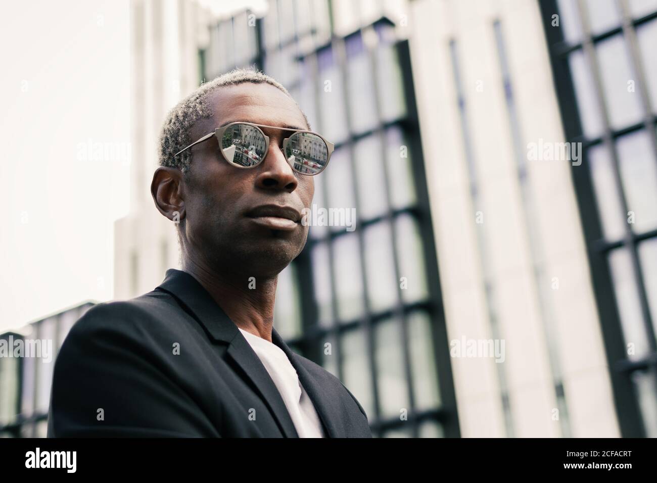 Stylish black businessman on street Stock Photo - Alamy