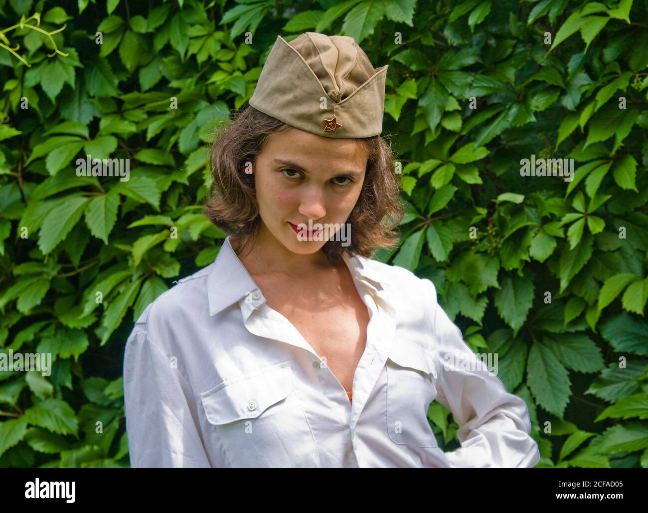 Beautiful girl wearing a soviet soldier cap Stock Photo - Alamy