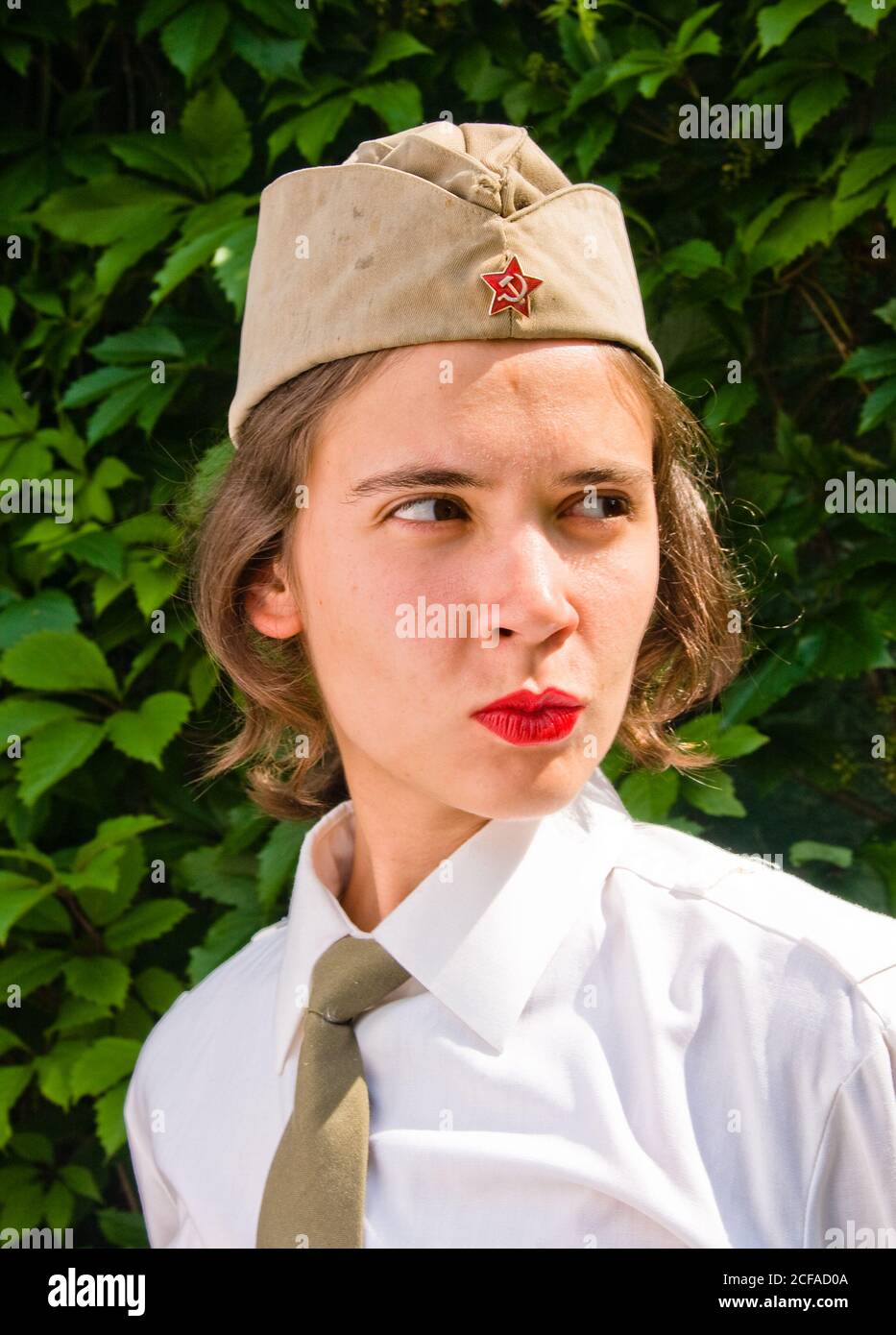 Beautiful girl wearing a soviet soldier cap Stock Photo - Alamy