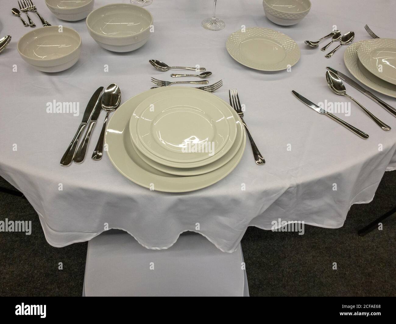 Ceramic Plates at Table Setup in Restaurant Stock Photo - Alamy