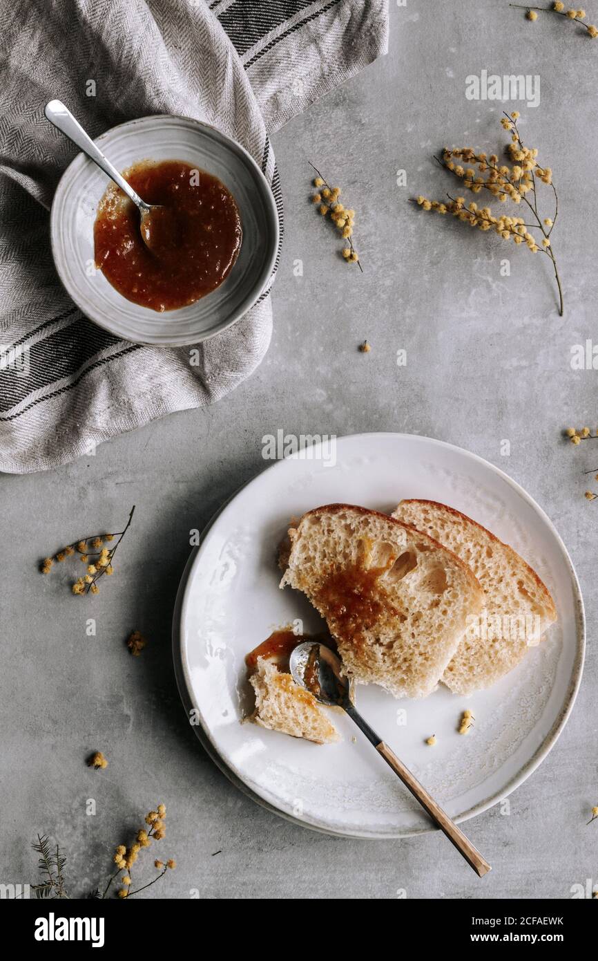 Top view of fresh slice of Brioche bread smeared with brown jam on ...