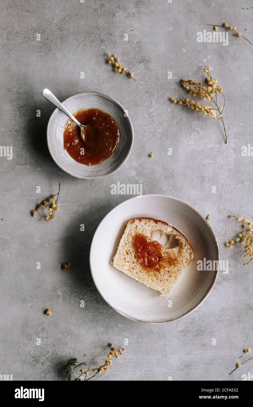 Top view of fresh slice of Brioche bread smeared with brown jam on ...