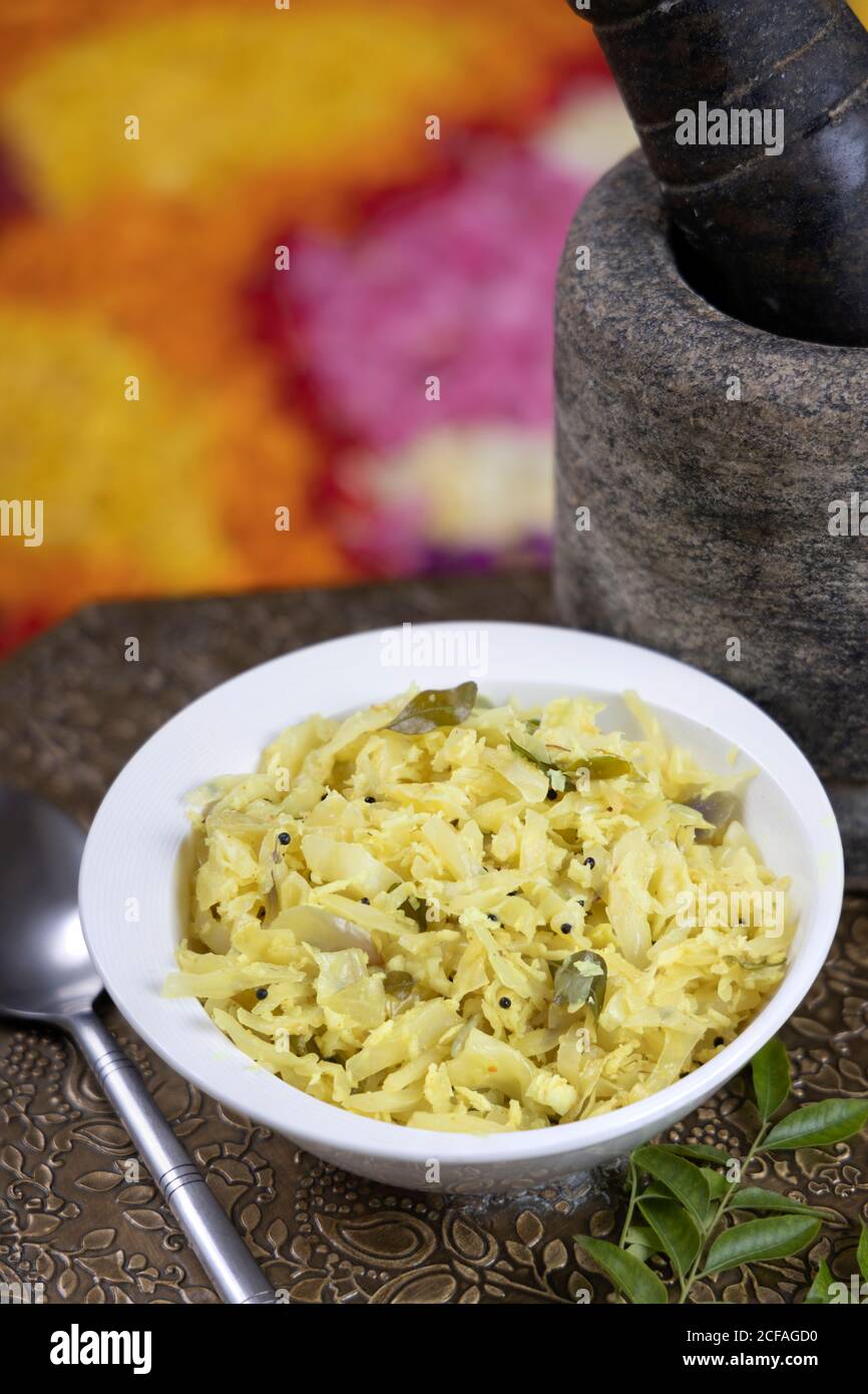 Kerala cabbage thoran dish served in white bowl Stock Photo - Alamy