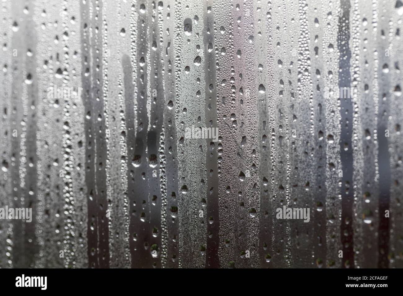 Steamy window with striped water drop pattern Stock Photo - Alamy