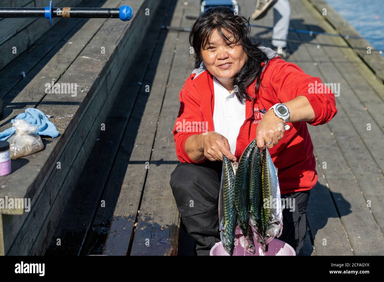 Asian woman fishing hi-res stock photography and images - Alamy