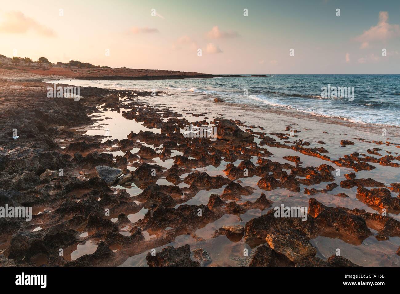 Rocky coast cyprus sunset hi-res stock photography and images - Alamy