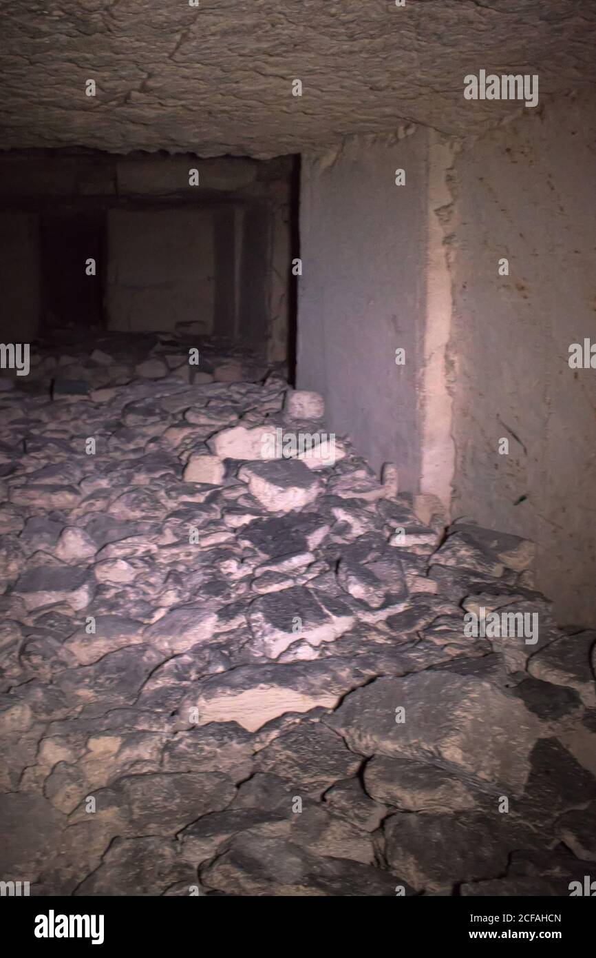 Old underground passage, dungeon, catacombs lined with stones ...