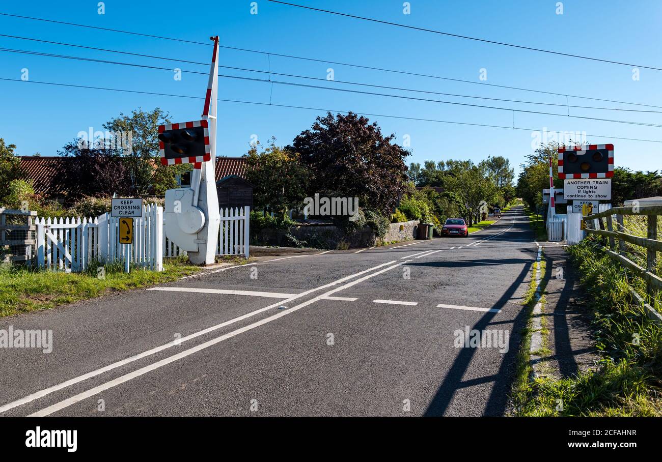 Safety barriers at East Coast mainline railway line level crossing ...