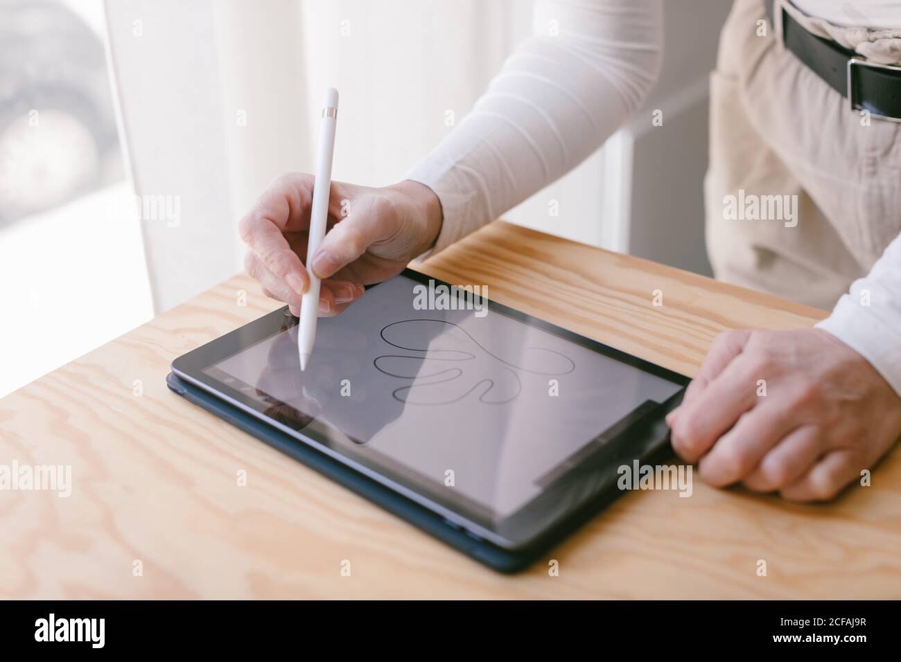 Bending over table hi-res stock photography and images - Alamy