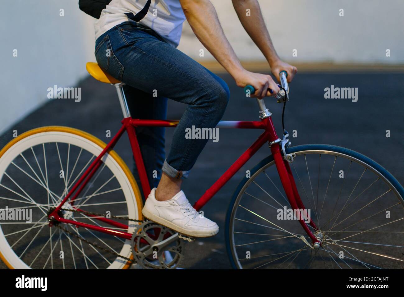 unrecognizable young man riding a fixie bike Stock Photo - Alamy