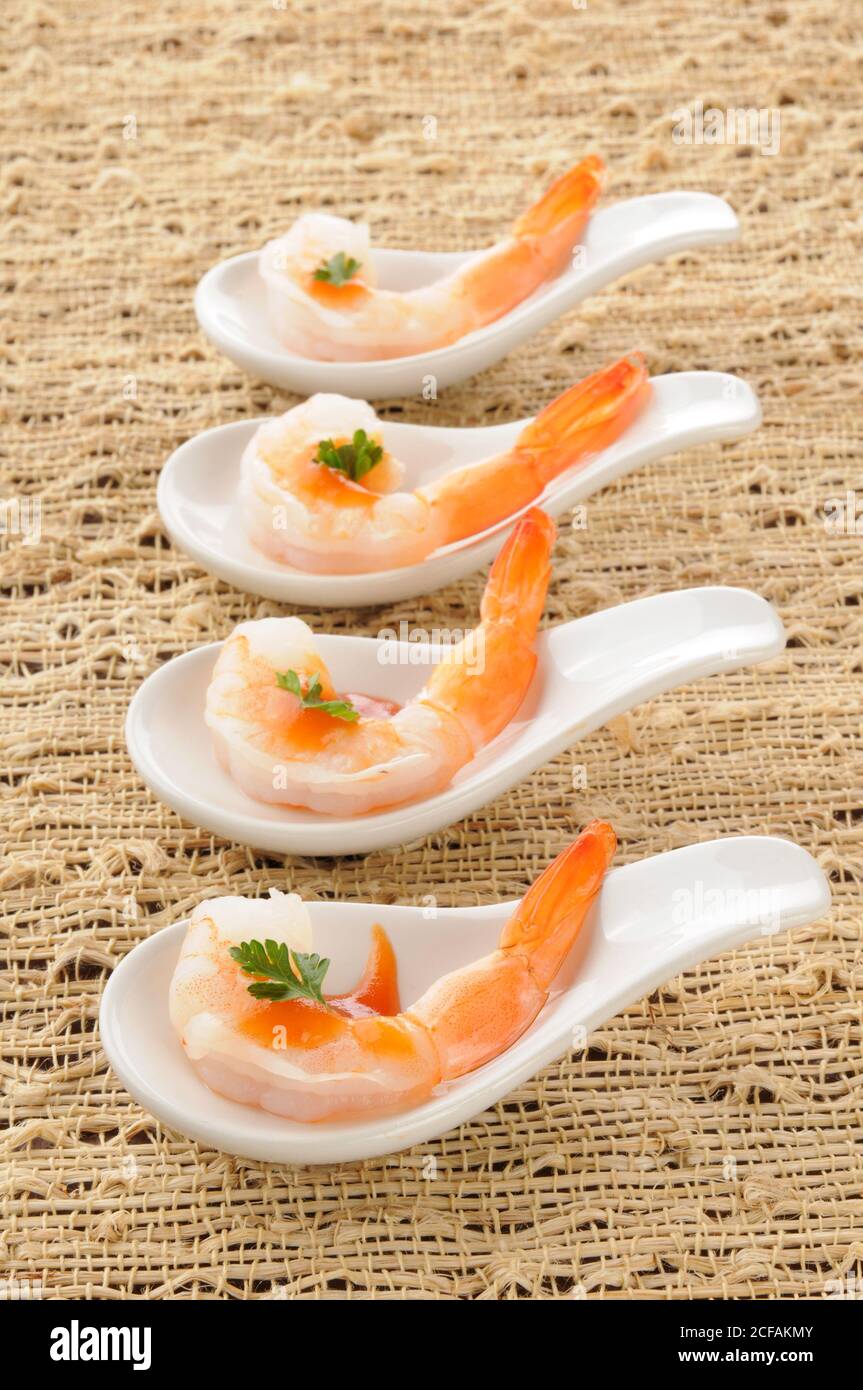 Shrimp prawns in small ceramic spoons with cocktail sauce Stock Photo ...