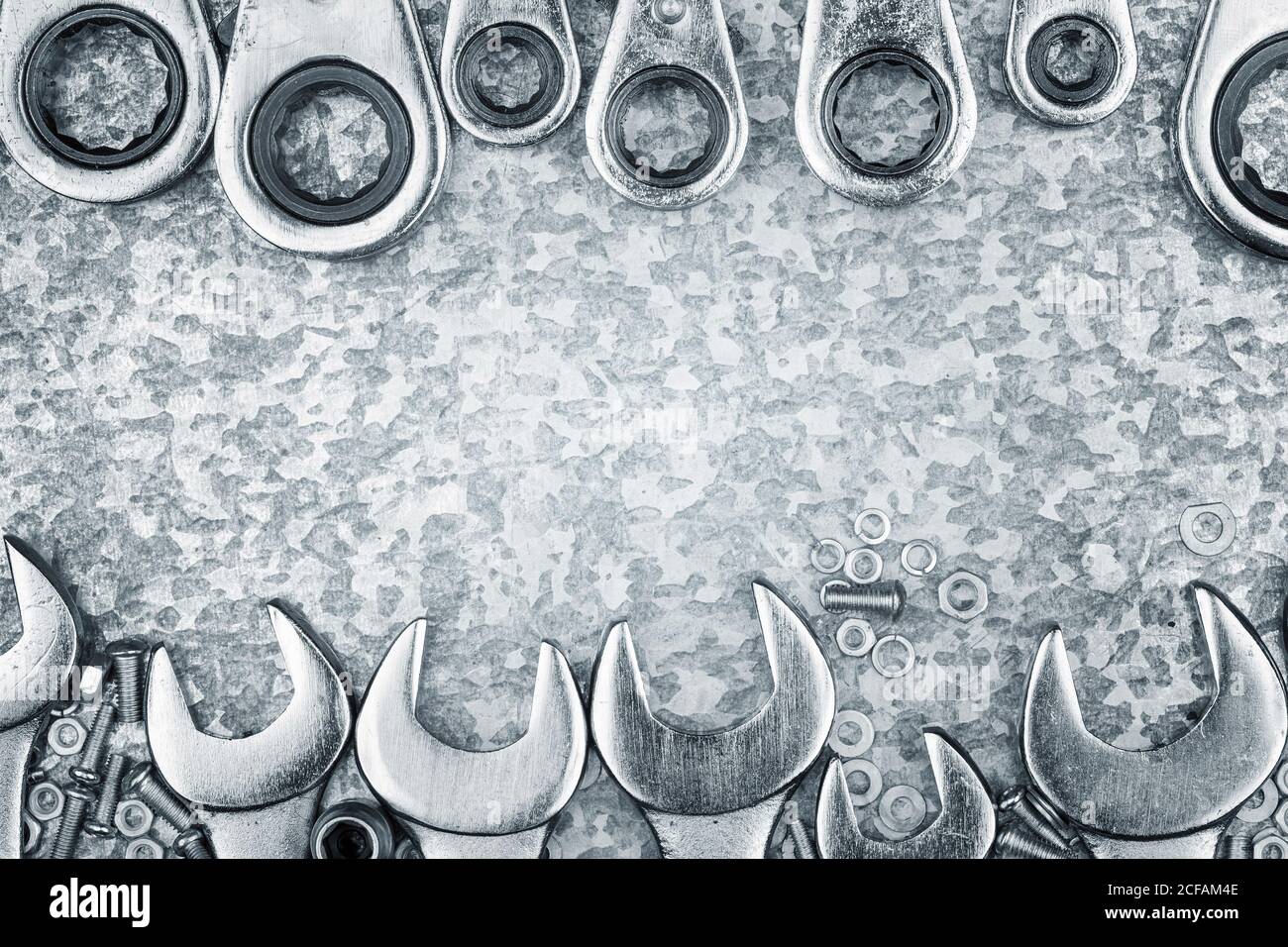 Mechanic and diy tools an a metallic background with space for text ...