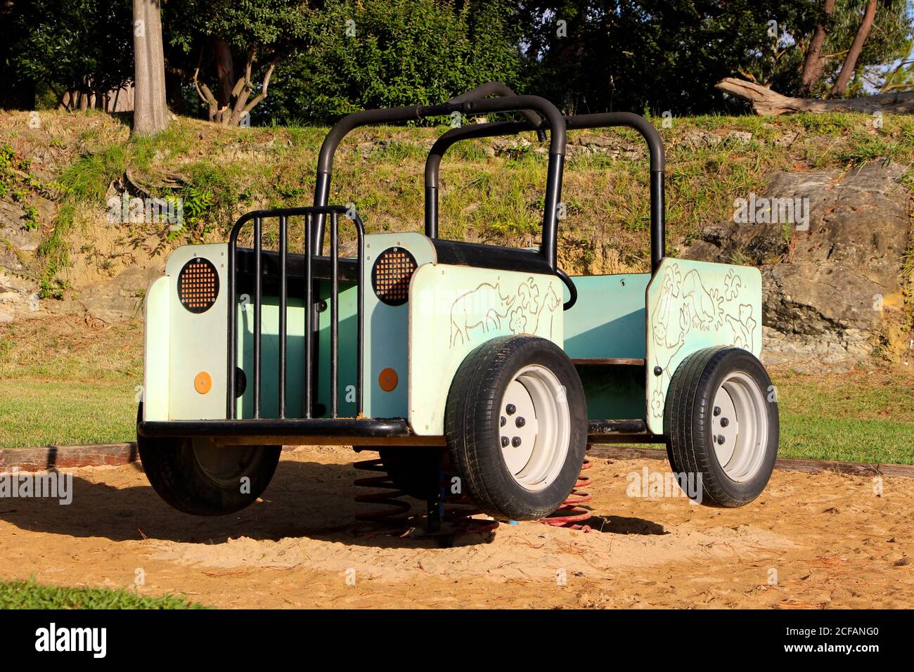 Play on playground green jeep car mounted on springs in the playground ...