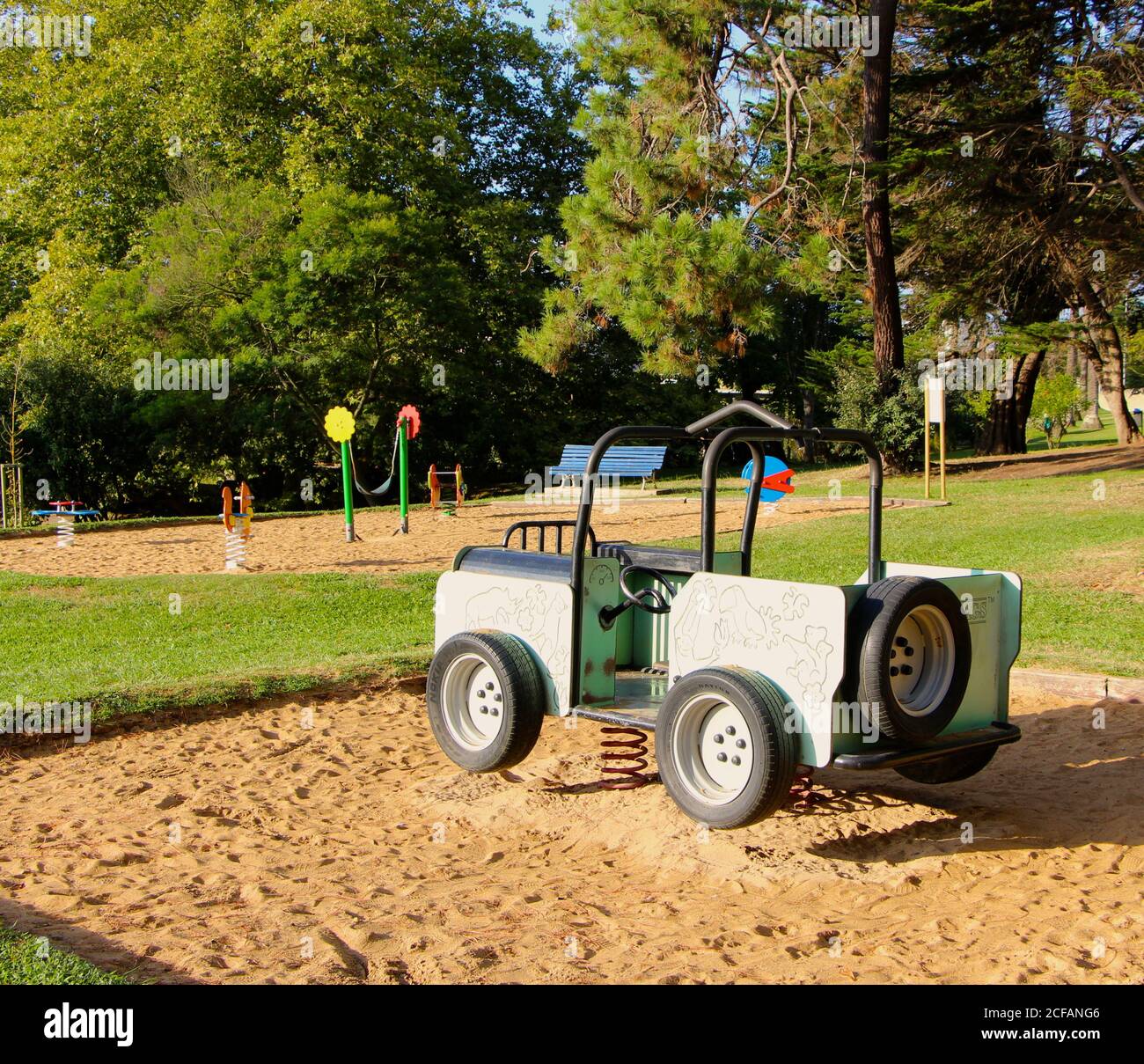 Play on playground green jeep car mounted on springs in the playground ...