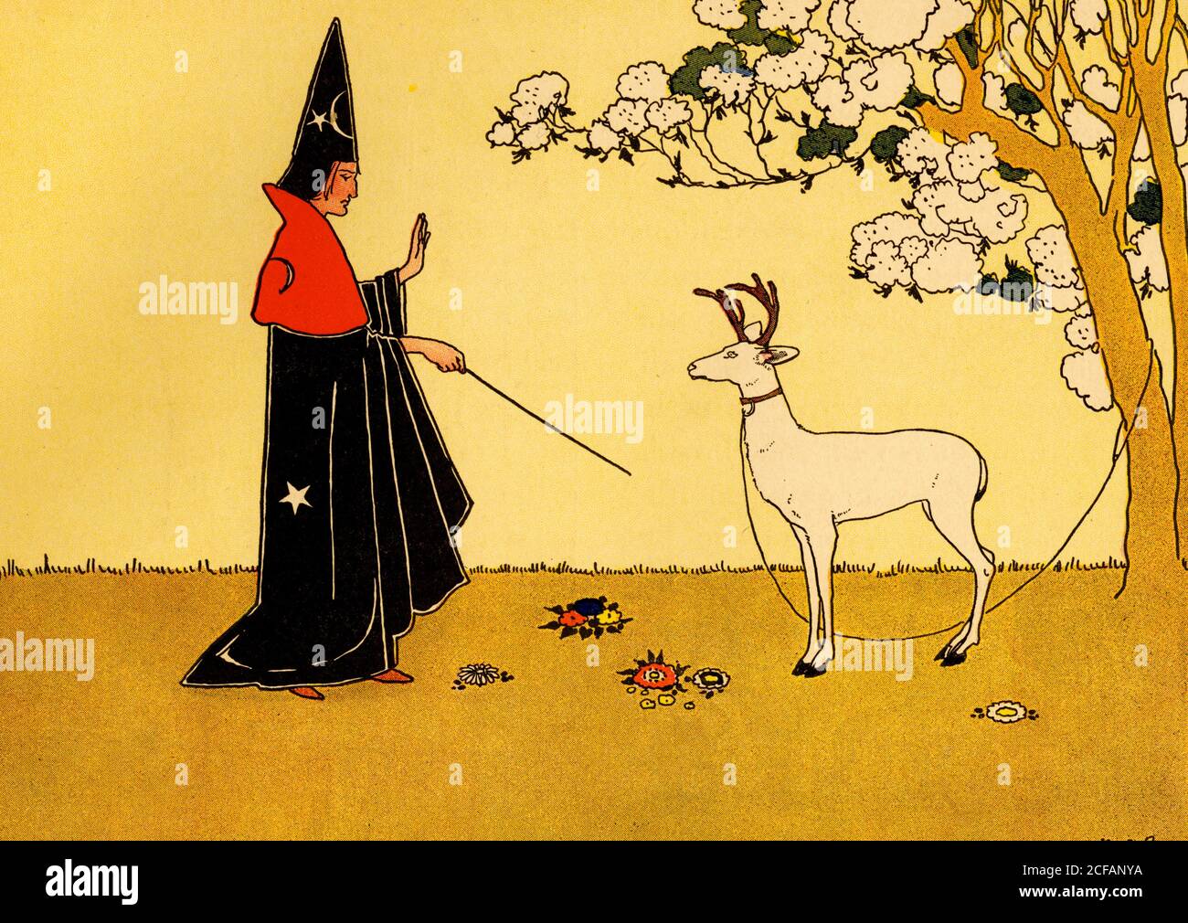 Sorcerer Hold a wand over a young deer with antlers Stock Photo - Alamy