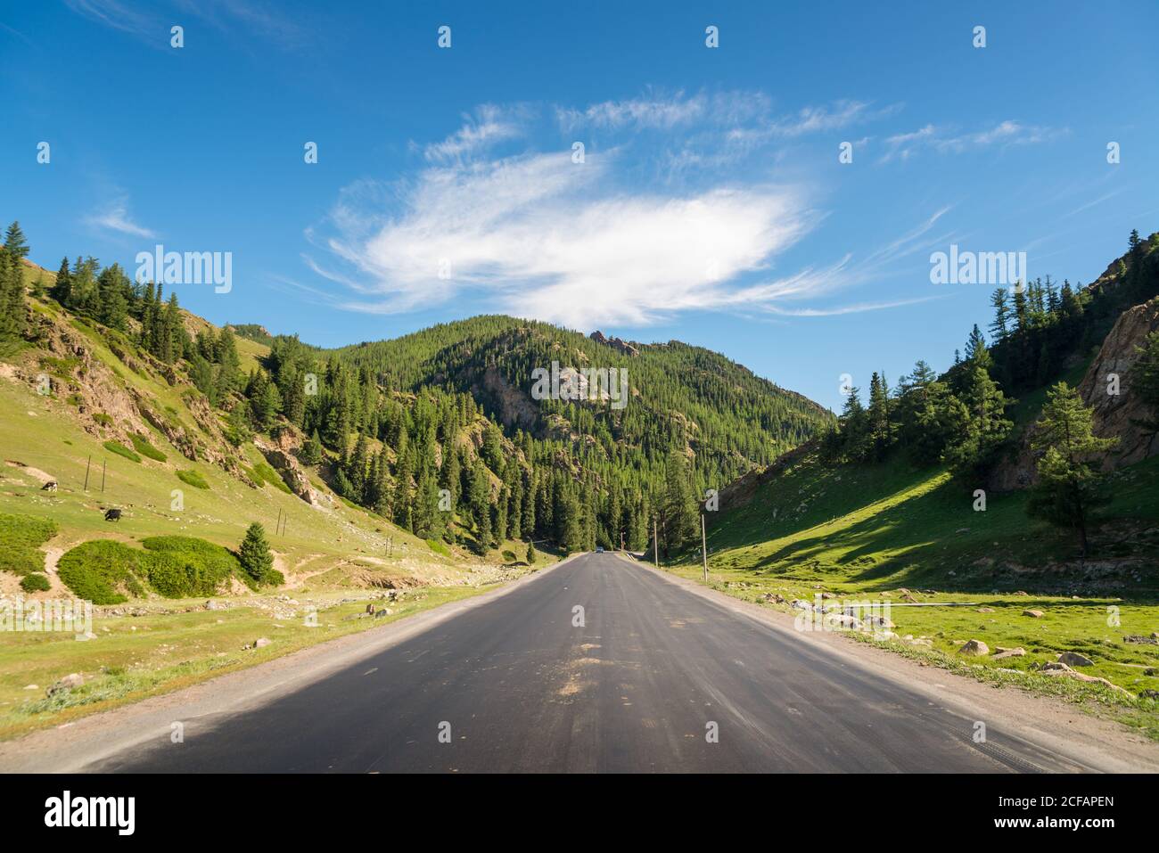Spectacular view of asphalt roadway surrounded by mountain slopes and ...