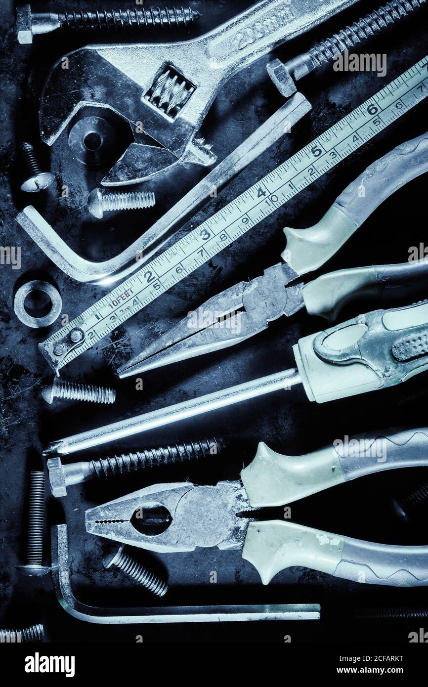 Set of manual tools and screws with a metallic blue color Stock Photo ...