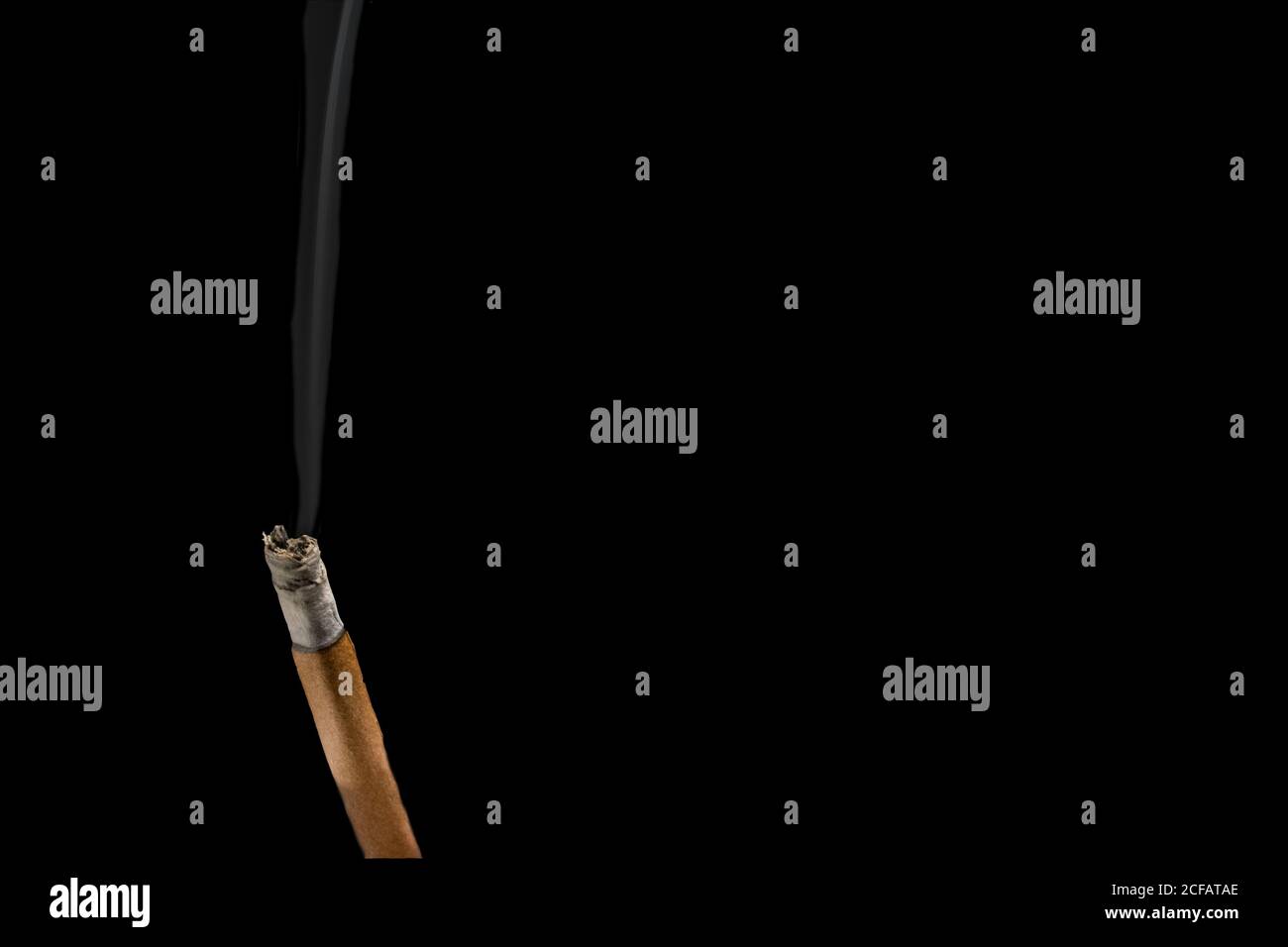 A Cannabis Cigar With Smoke Flowing From it on a Black Background Stock ...