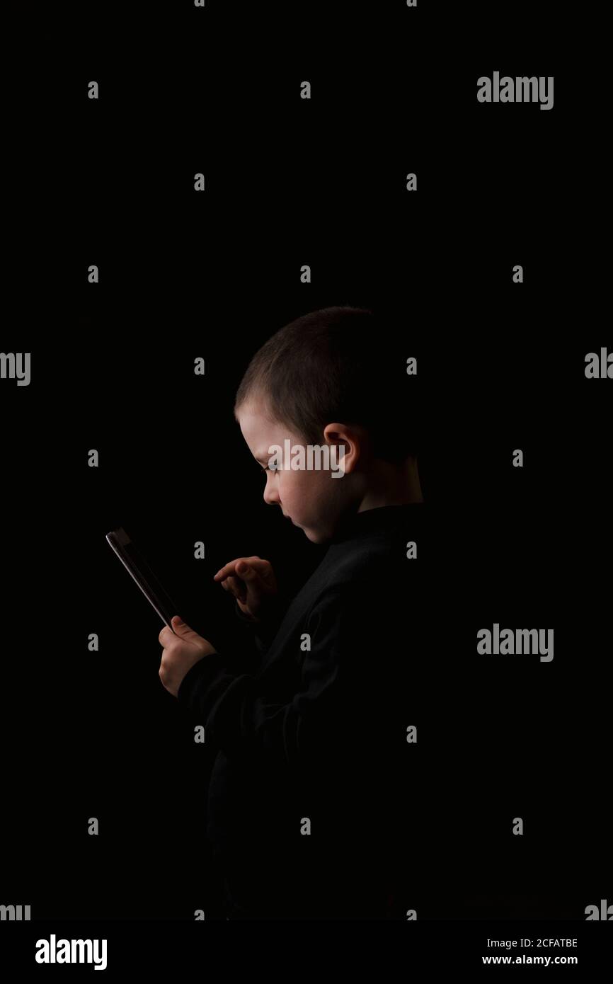 Determined child tablet hi-res stock photography and images - Alamy