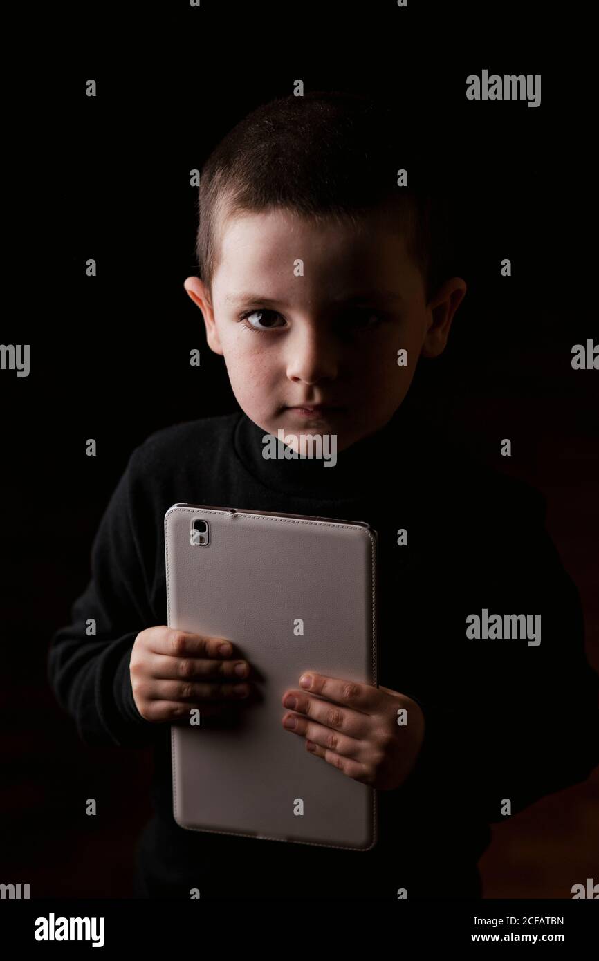 Determined child tablet hi-res stock photography and images - Alamy