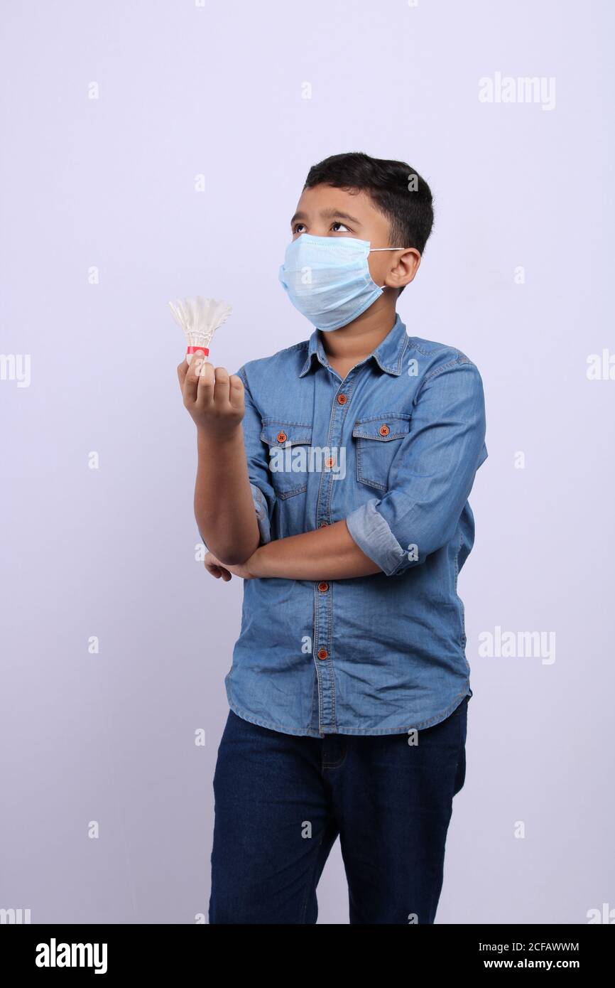 boy wearing mask with toy isolated over white background Stock Photo ...