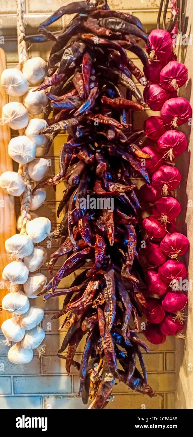 hanging display of onions garlic and chillies Stock Photo - Alamy