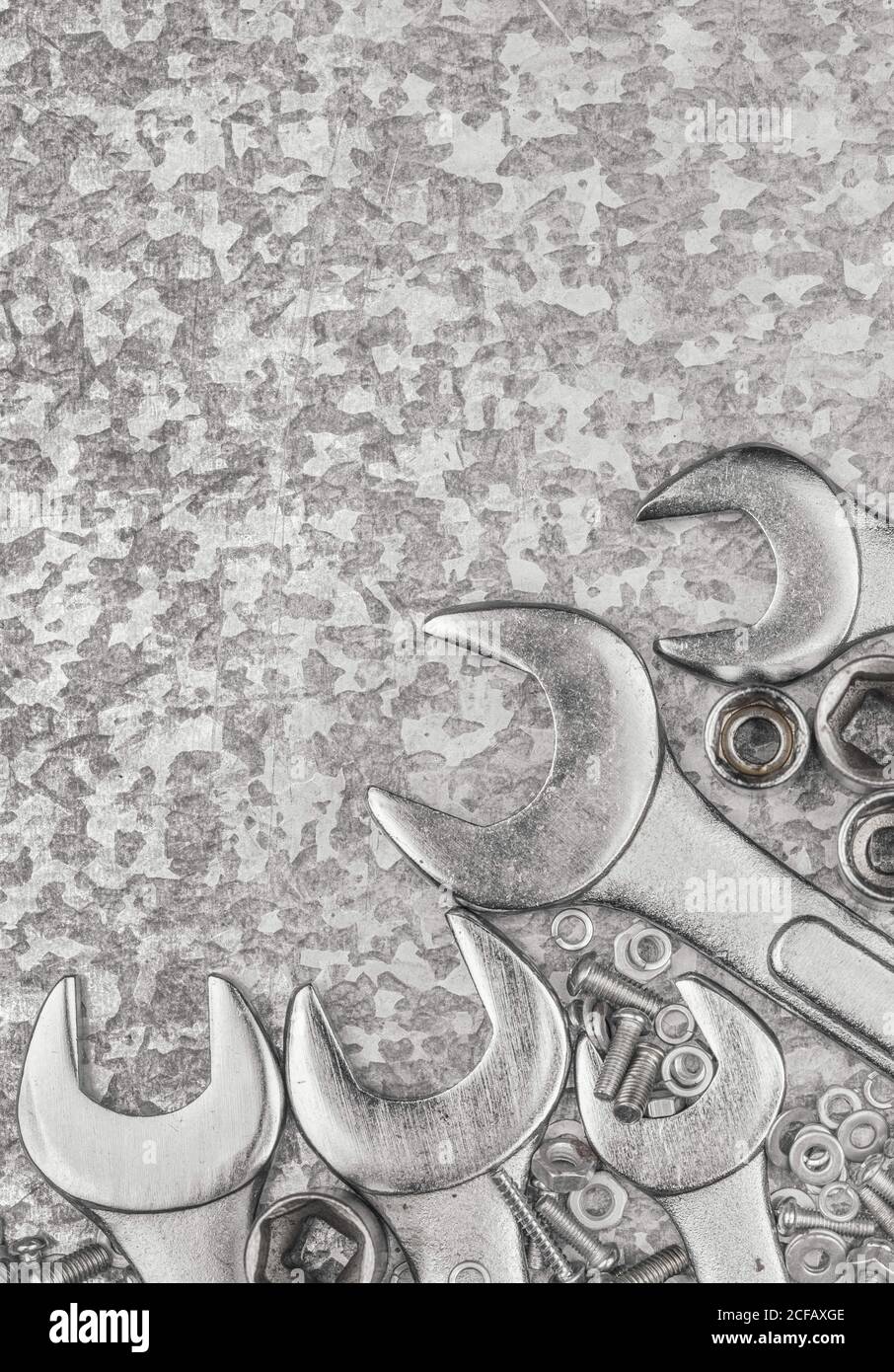 Set of mechanic tools on a metallic background with space for text ...