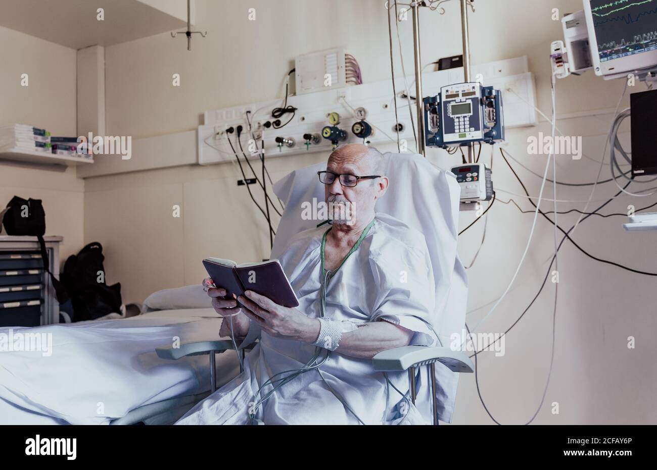 Older man admitted to a hospital room due to health problems Stock ...