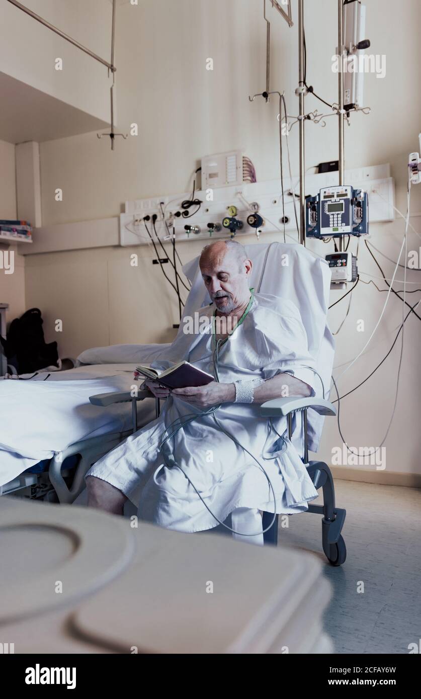 Older man admitted to a hospital room due to health problems Stock ...