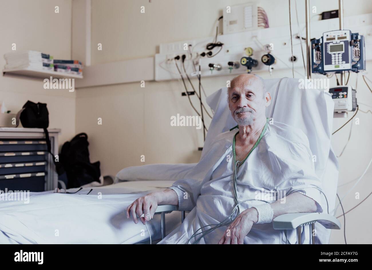Older man admitted to a hospital room due to health problems Stock ...