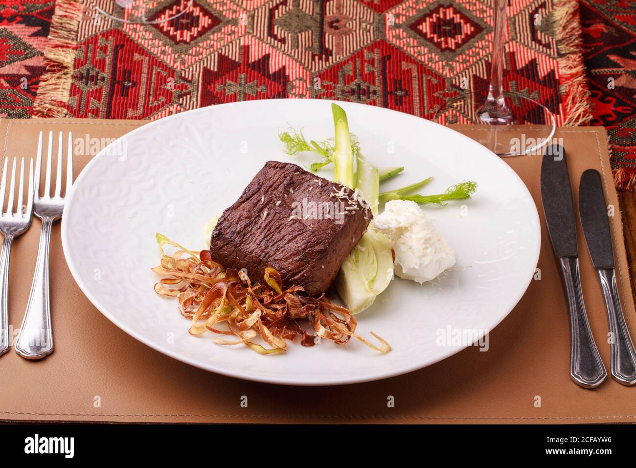 Venison fillet served with Leek slice, Fried Onion and Creamy ...