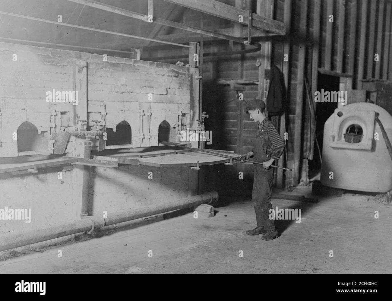 Carrying in Boy at the Lehr. Glass Factory Stock Photo - Alamy
