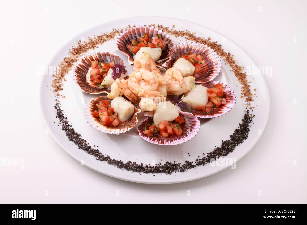 Mixed seafood platter (Scallops with tomato salsa and shrimp) served ...