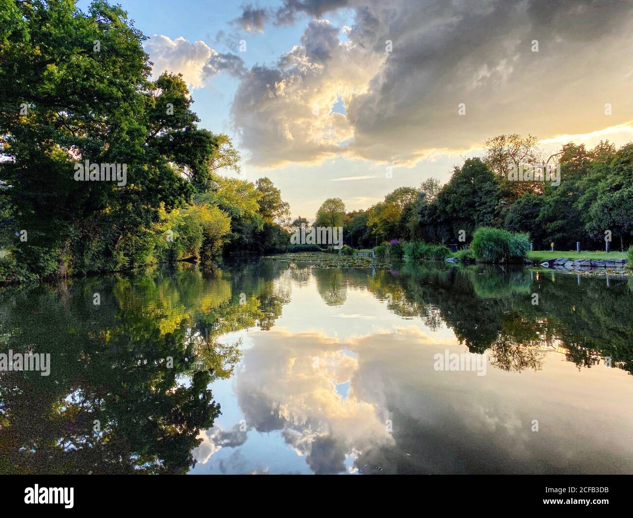 The sun sets over Long Pond on Totteridge Common in Barnet, north ...