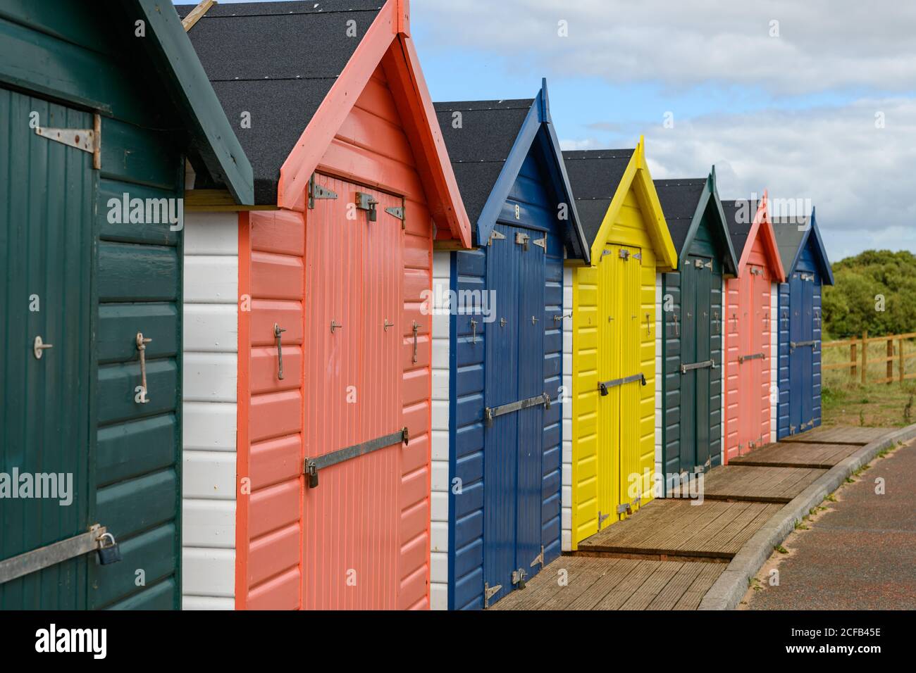 Colorful beach huts in Devon Stock Photo - Alamy