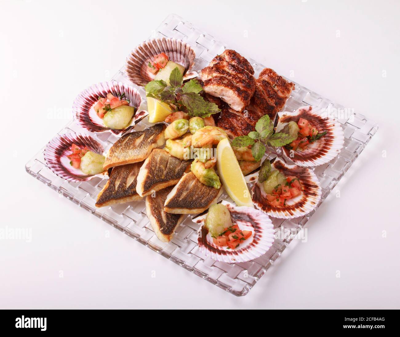 Platter of mixed Grilled Seafood & Fish. (Sea bass, Scallops, Shrimp ...