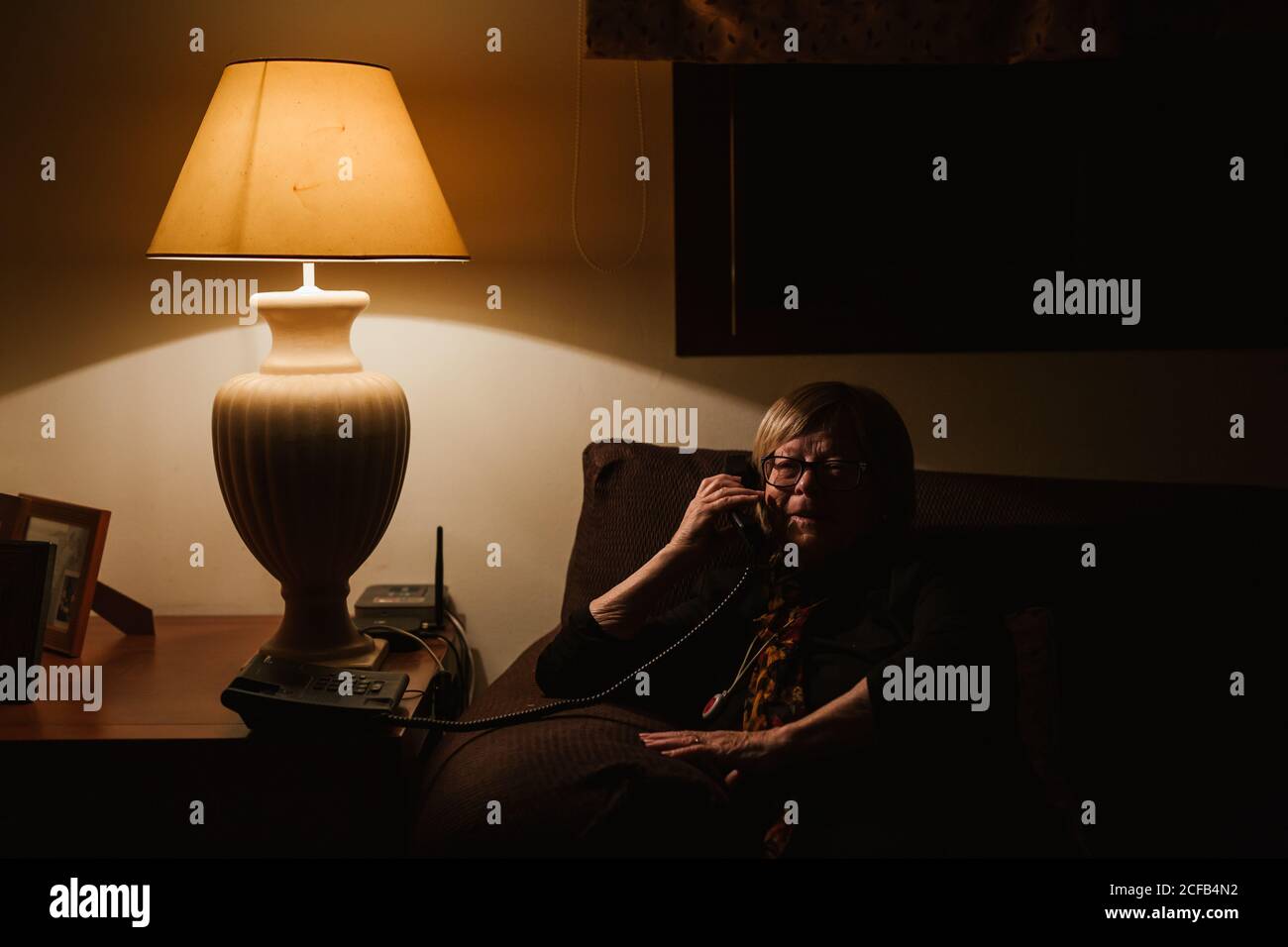 Senior woman phone call night hi-res stock photography and images - Alamy